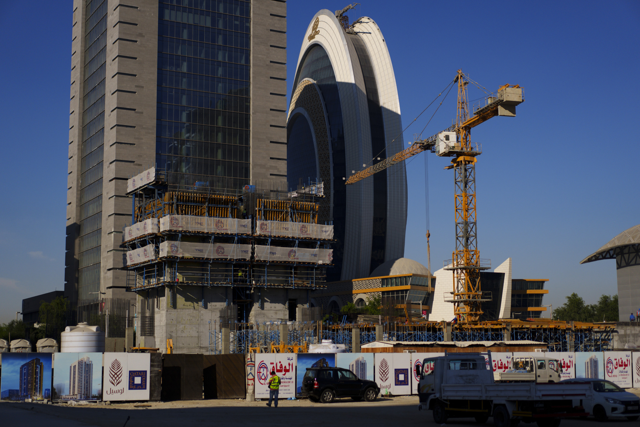 World Cup 2022A crane operates on a construction cite with the ...